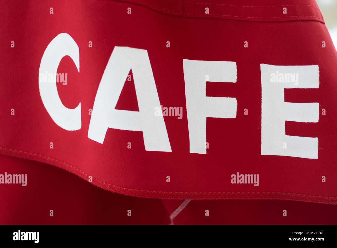 bright red and white cafe sign banner on cloth material Stock Photo - Alamy