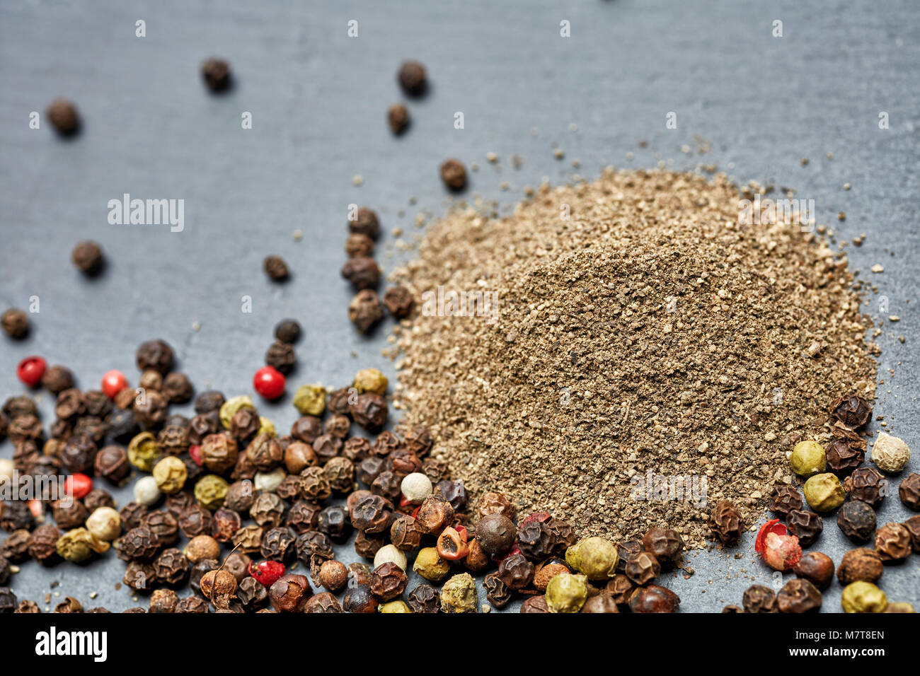 Different types of pepper. Mix of grind black pepper and allspice seeds ...