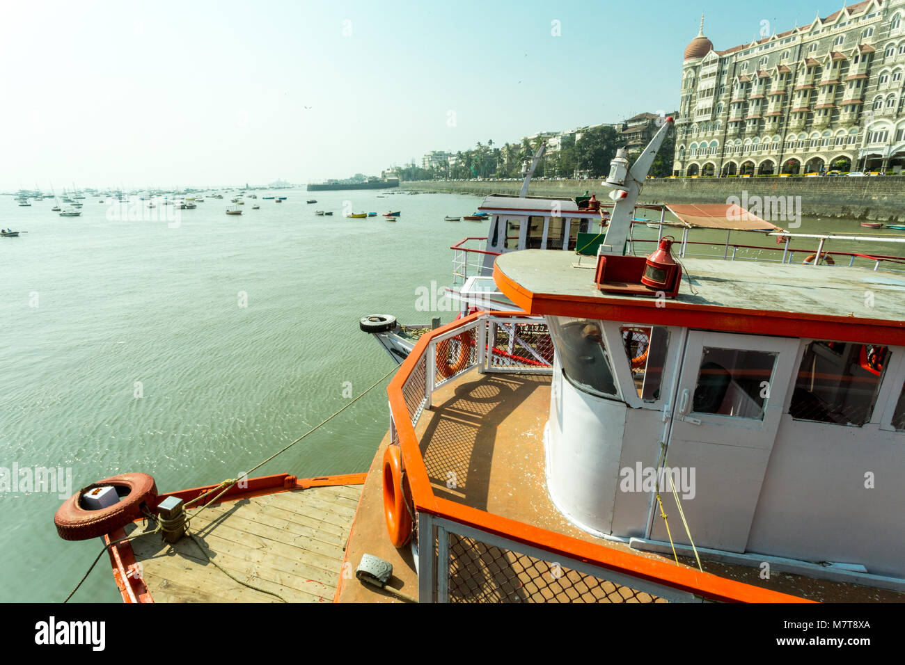 An Orange Tug Boat in Mumbai Stock Photo - Alamy