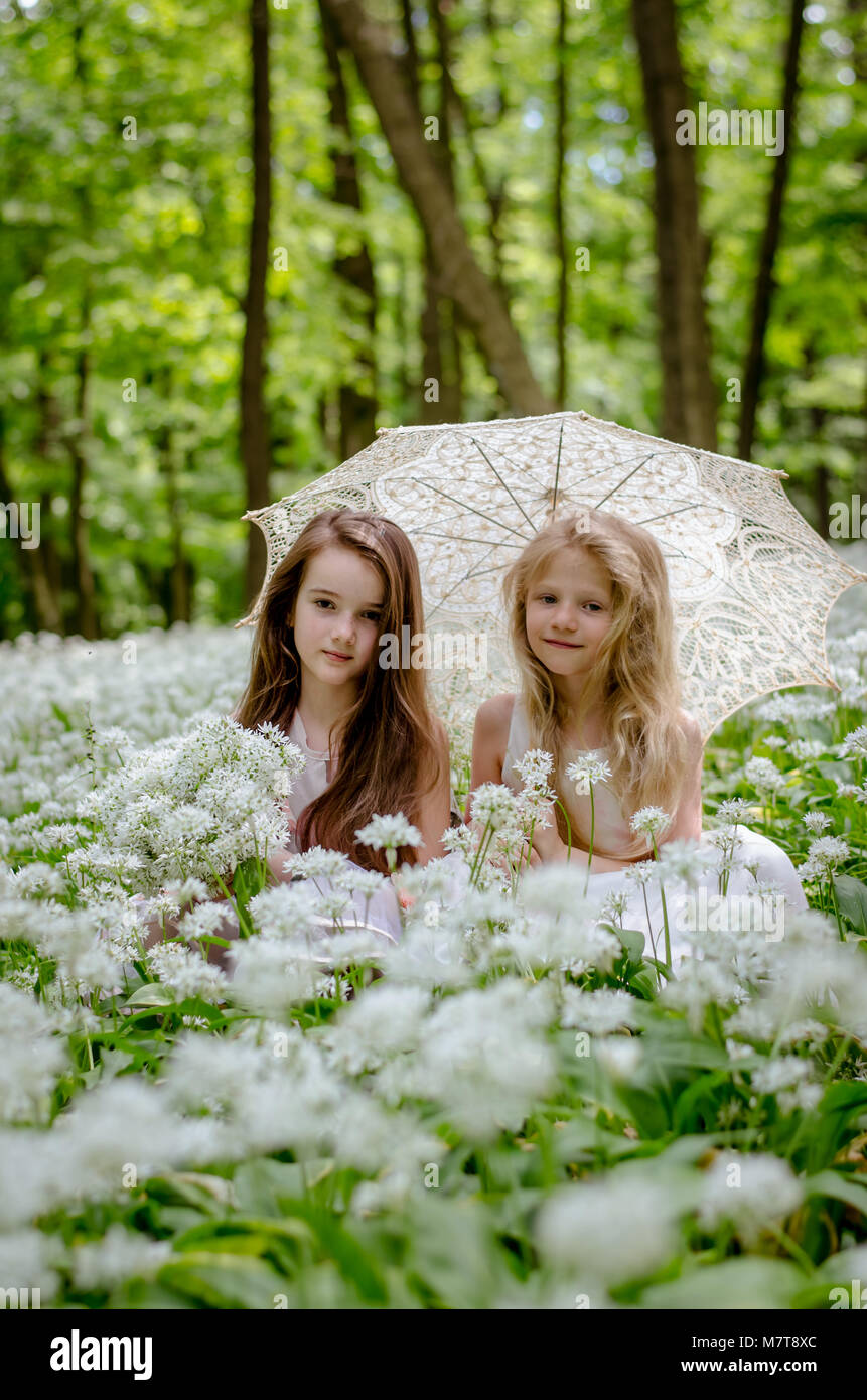 happy friends girls enjoying time in spring forest Stock Photo - Alamy