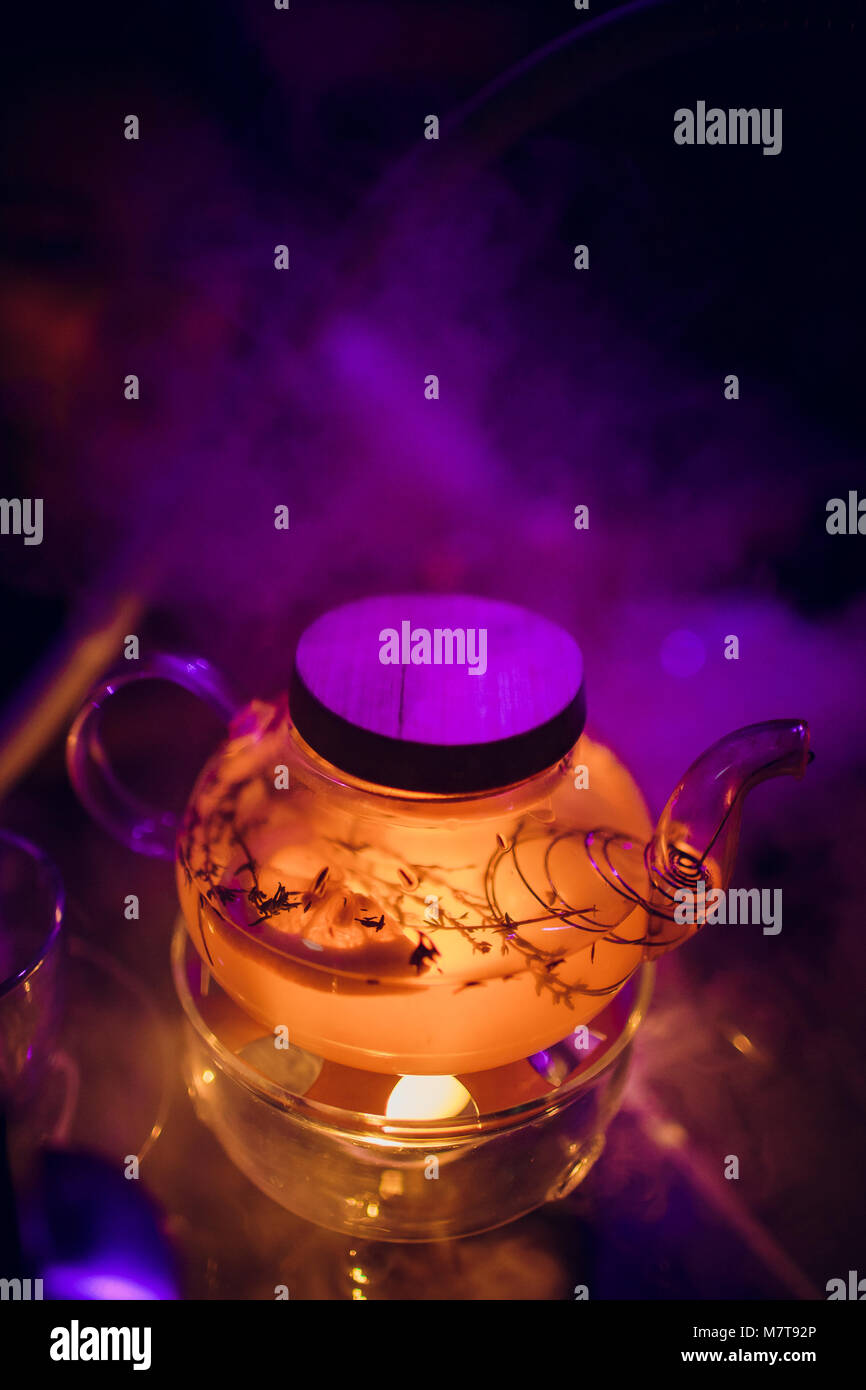 Hot steaming tea with an open book color Stock Photo - Alamy