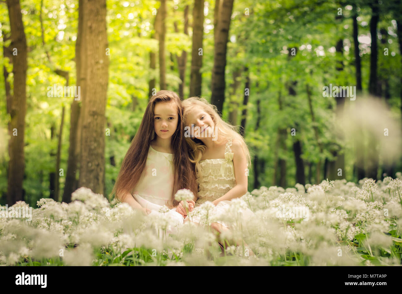 happy friends girls enjoying time in spring forest Stock Photo - Alamy