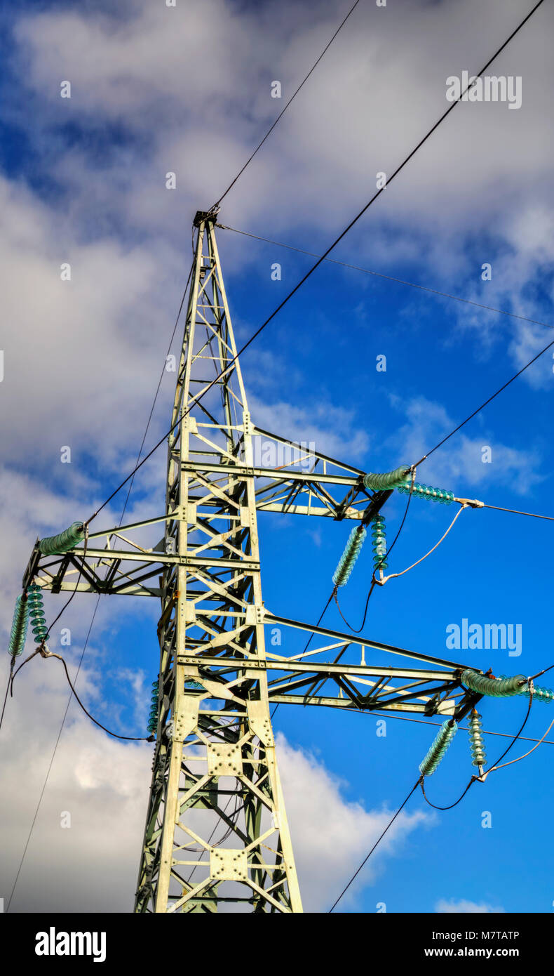 High voltage electrical overhead line on blue sky Stock Photo - Alamy