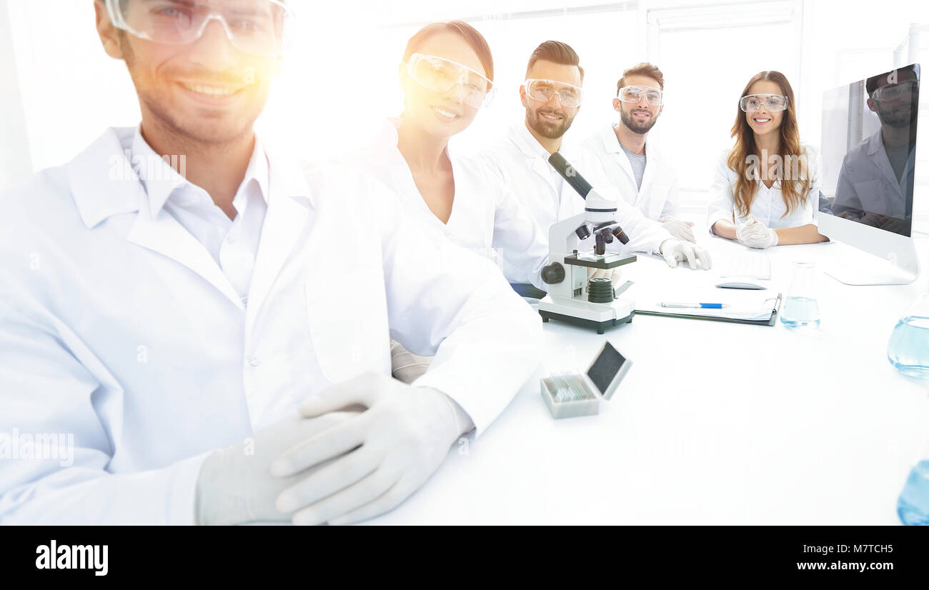 Male scientist and the team in the lab Stock Photo - Alamy
