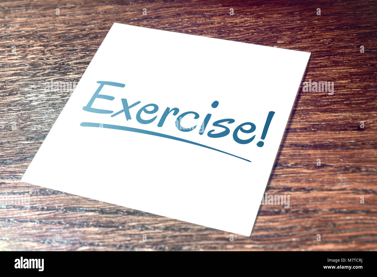 Exercise Sticky Note On Paper Lying On Wooden Cupboard Stock Photo - Alamy