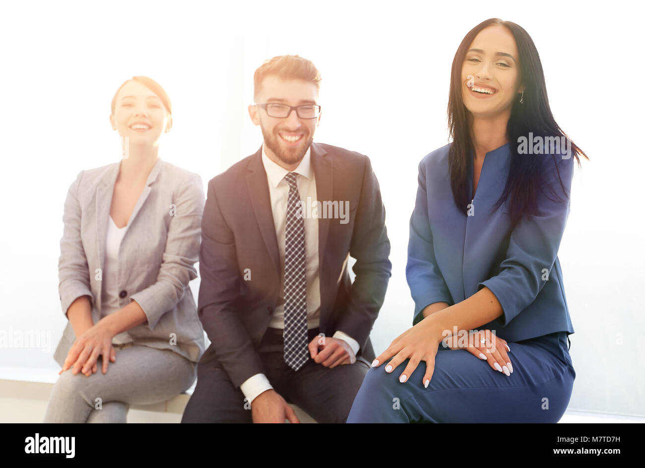 Smiling and confident business team having time break Stock Photo - Alamy