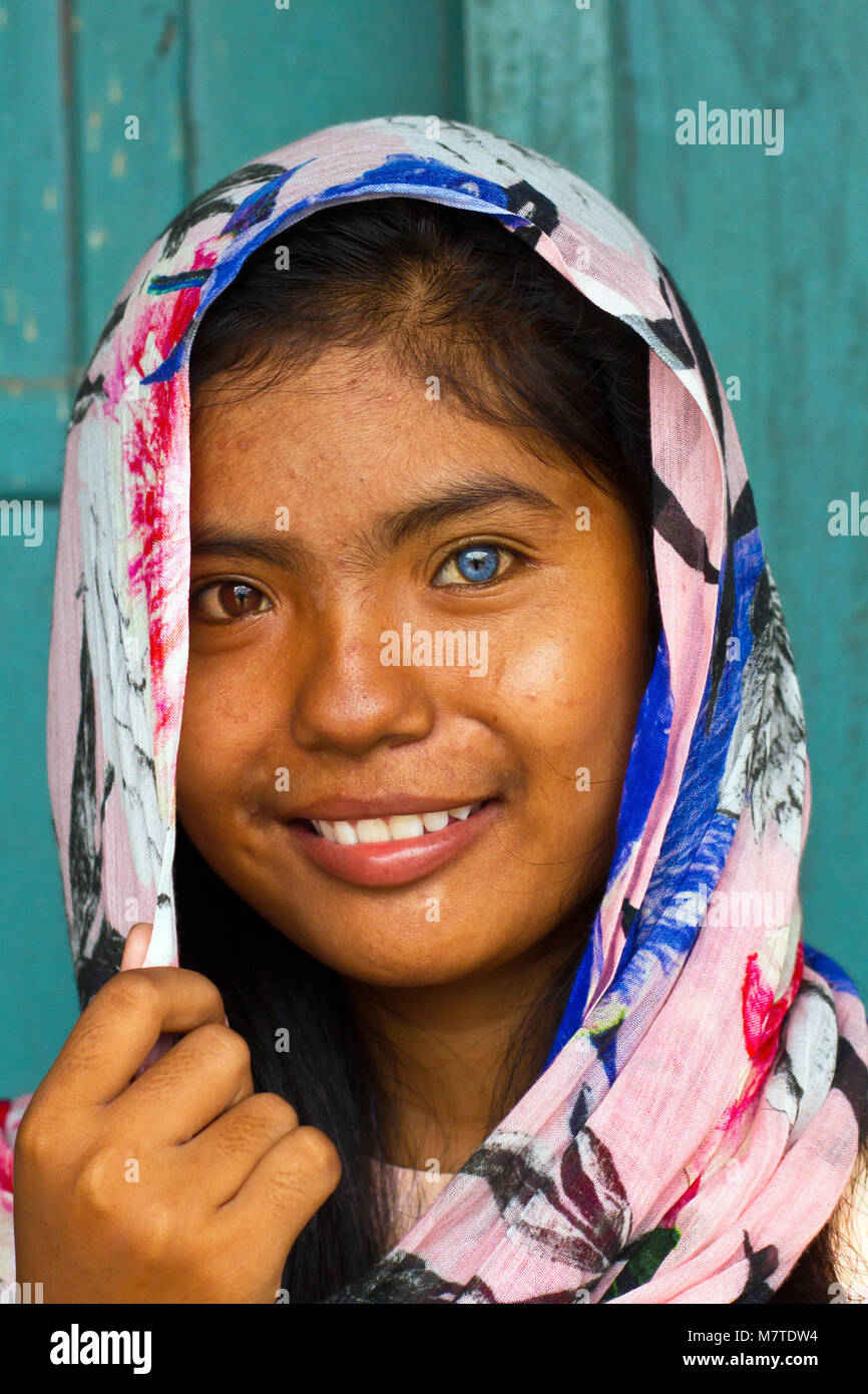 Blue- and green eyed young woman of the Cham Muslim minority people in ...