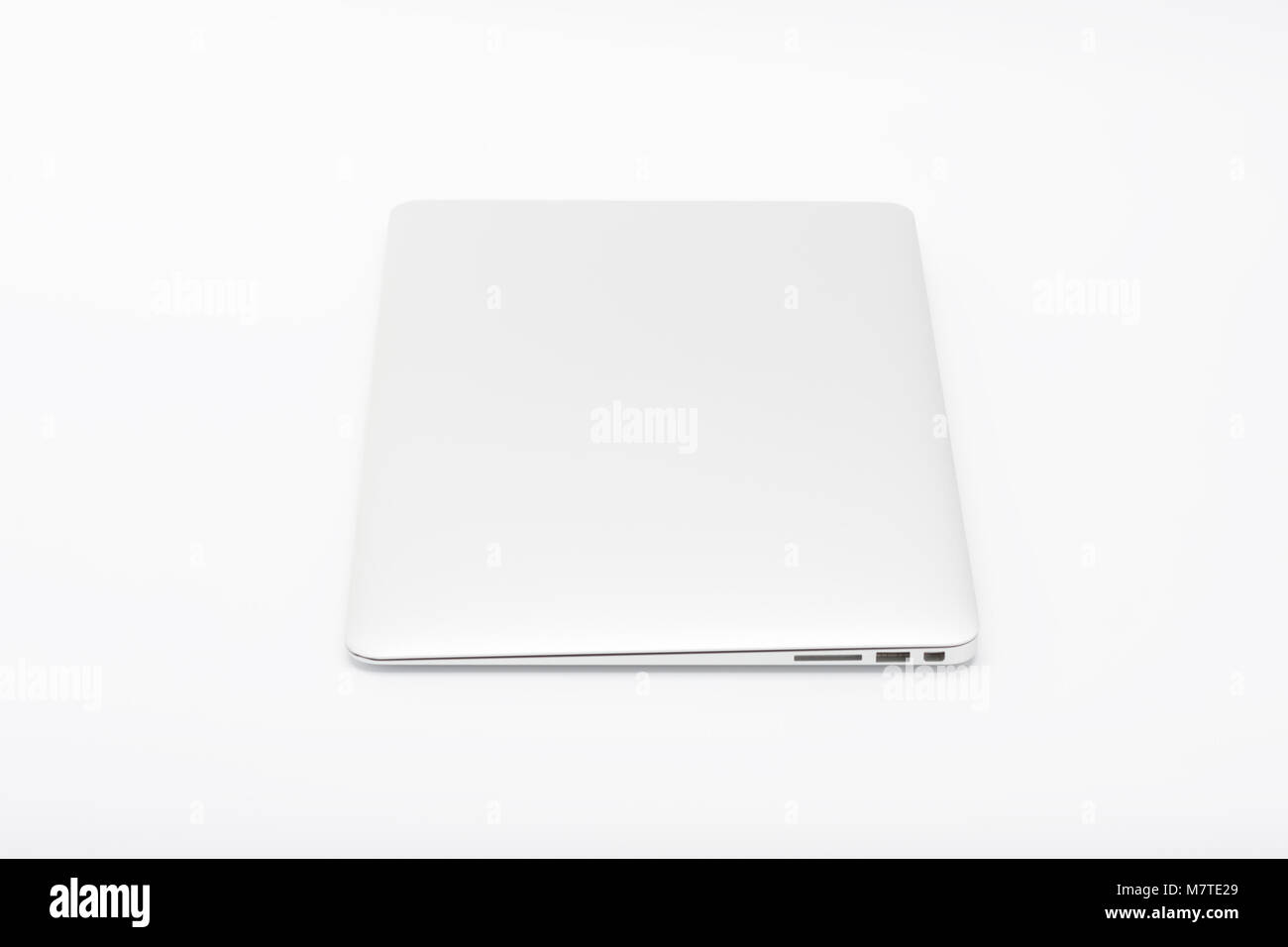 Closed modern, new laptop on white background, top side view Stock ...