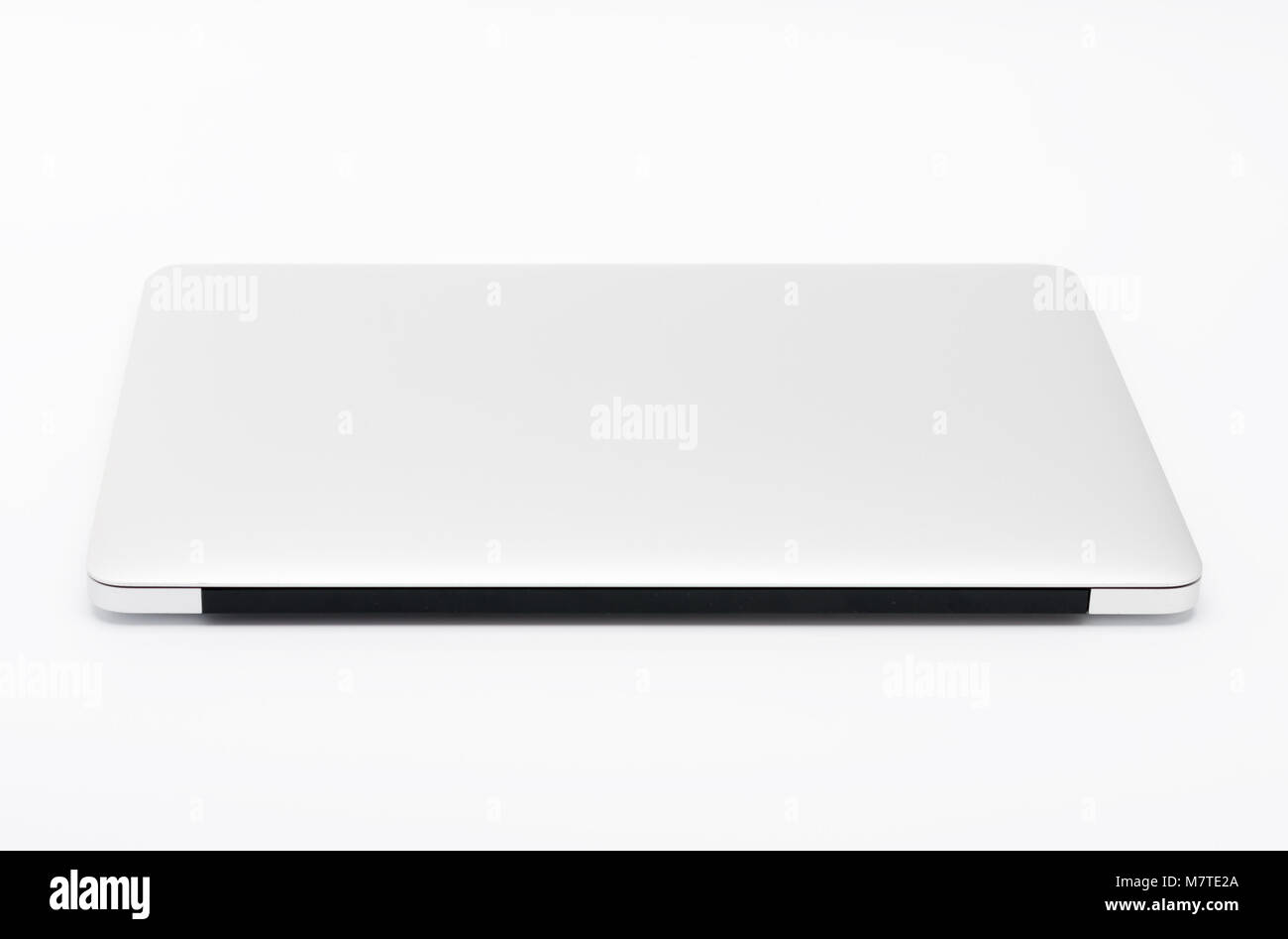 Closed modern, new laptop on white background, back view Stock Photo ...
