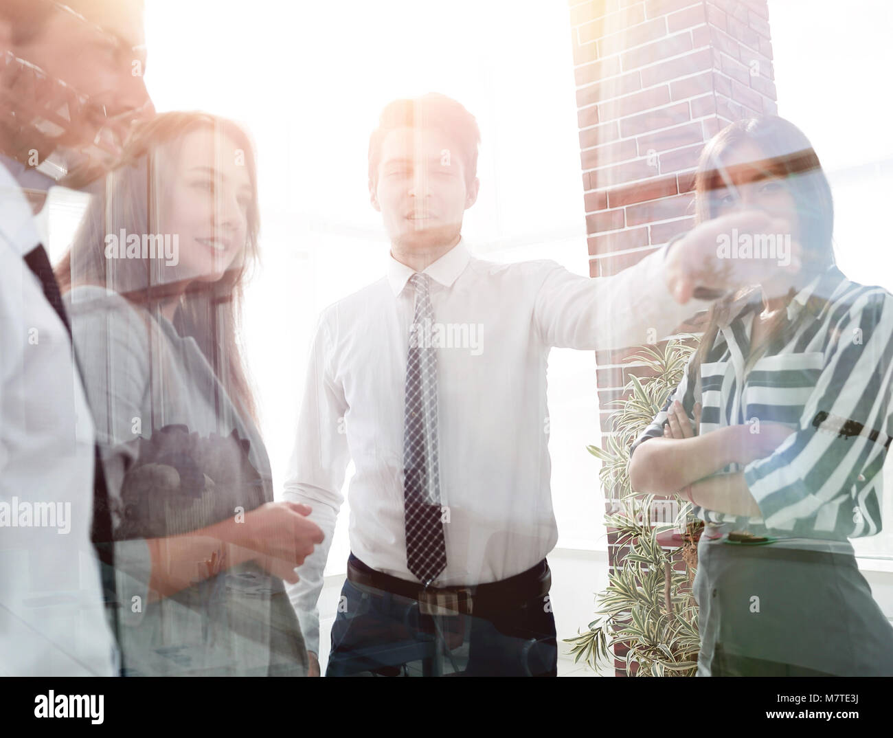 from behind the glass.business team in the officce Stock Photo - Alamy