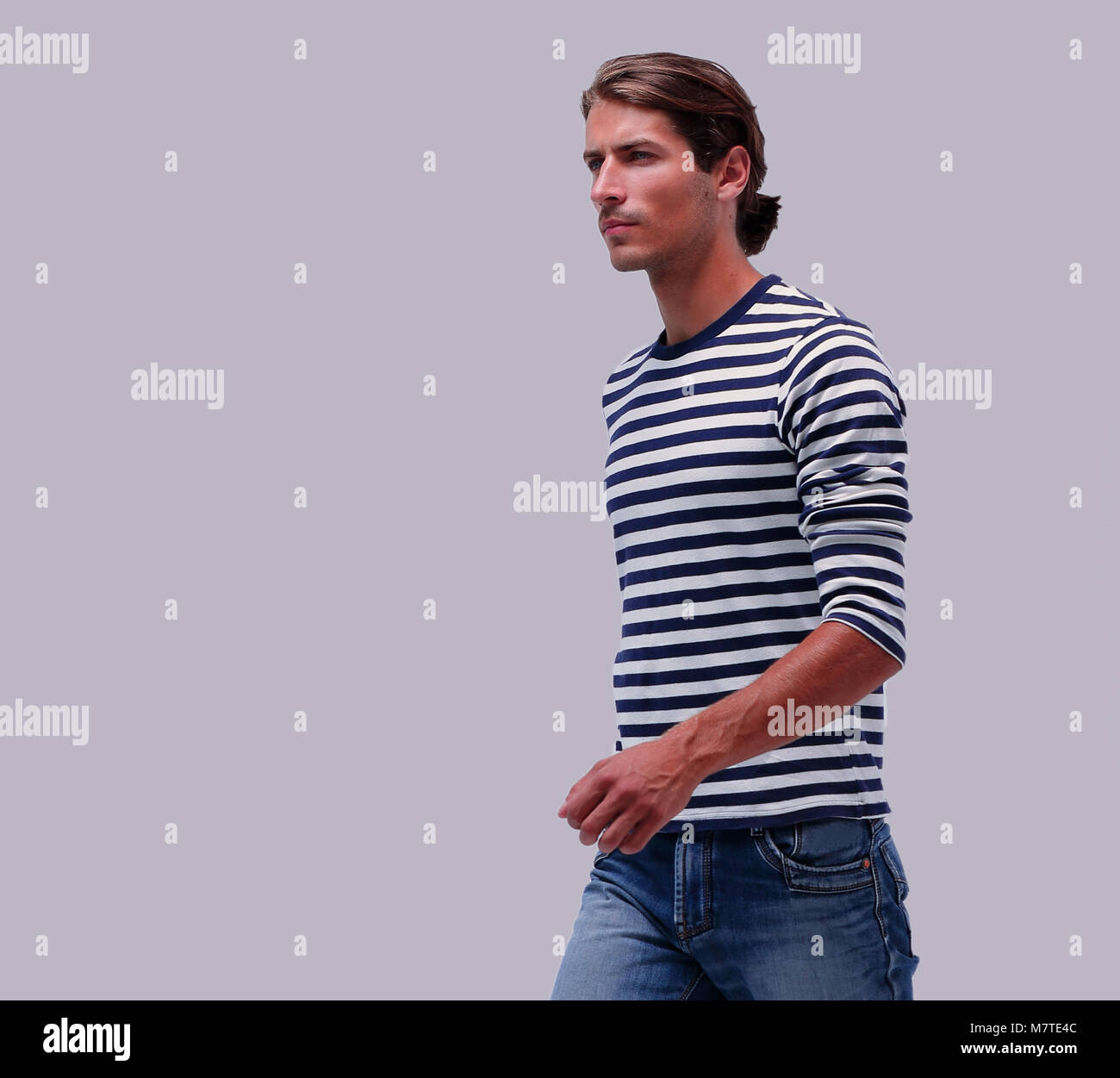 Side view.strong young man goes forward Stock Photo - Alamy