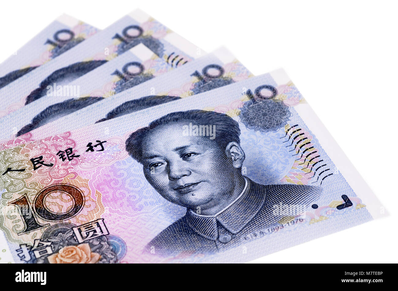 Several Chinese Ten Yuan currency bills isolated on a white background ...