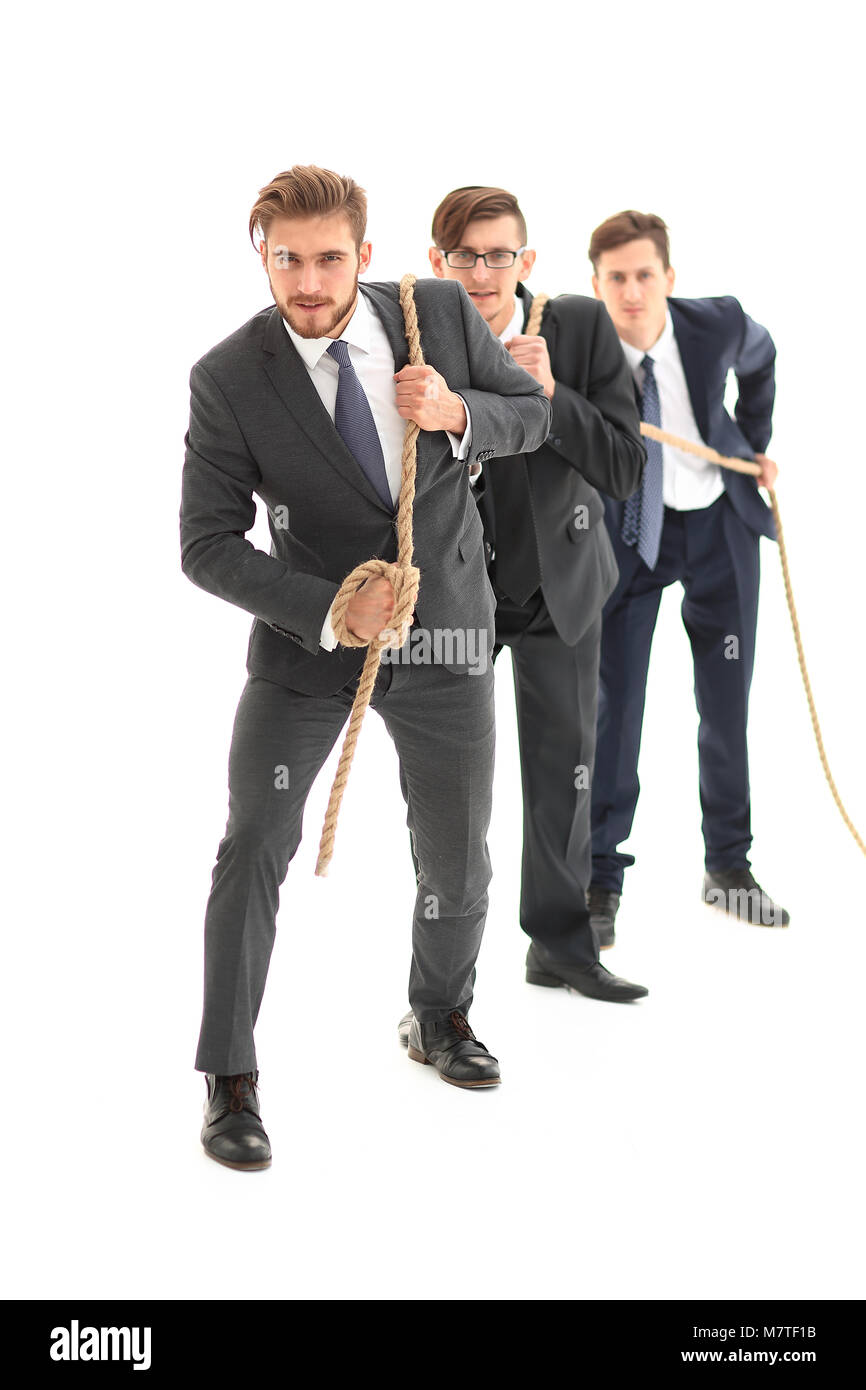 closeup.smiling business team pulls the rope Stock Photo - Alamy