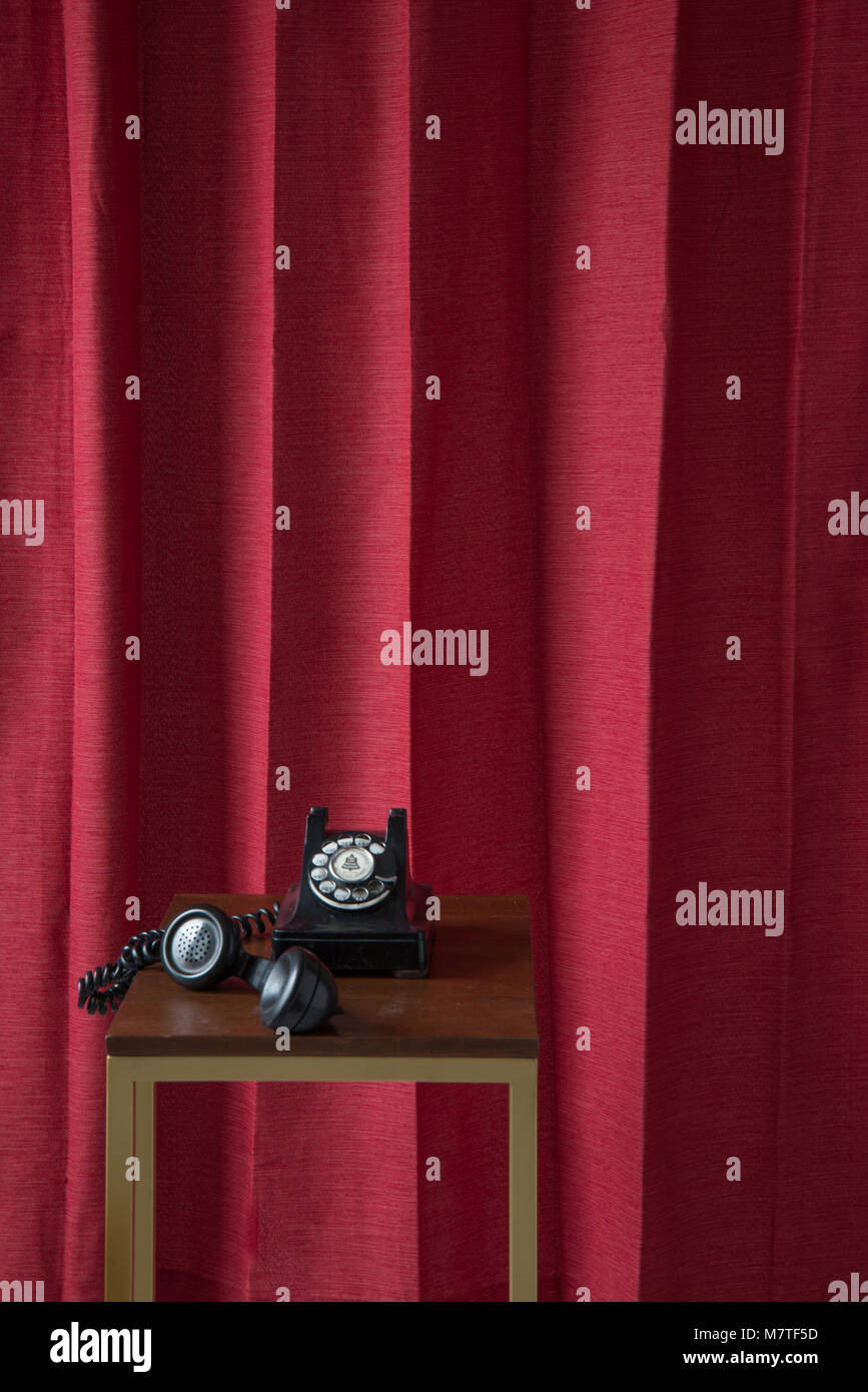 object on table in front of curtain Stock Photo - Alamy