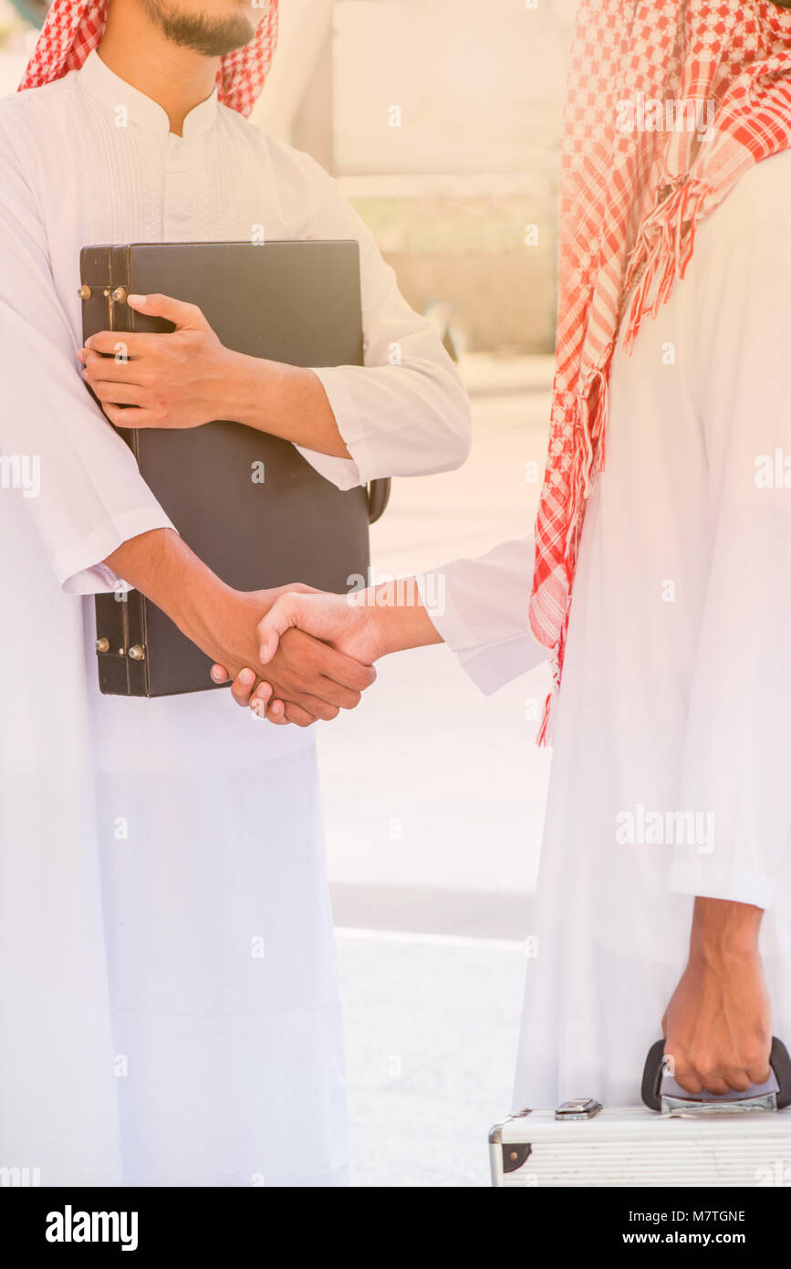Muslim business handshake and teamwork for achievement KPI and goal ...