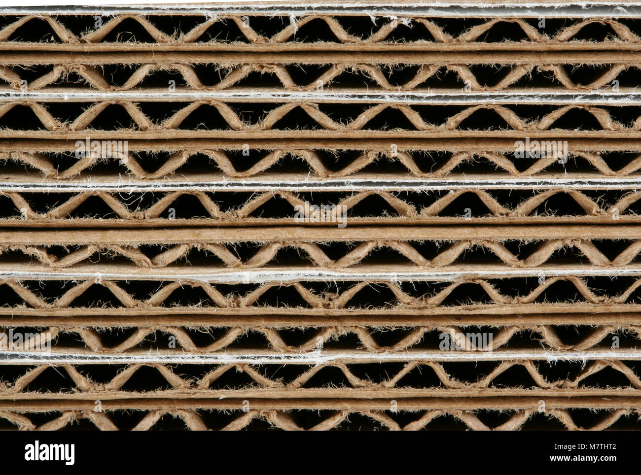 A Stacked corrugated cardboard boxes macro background Stock Photo - Alamy