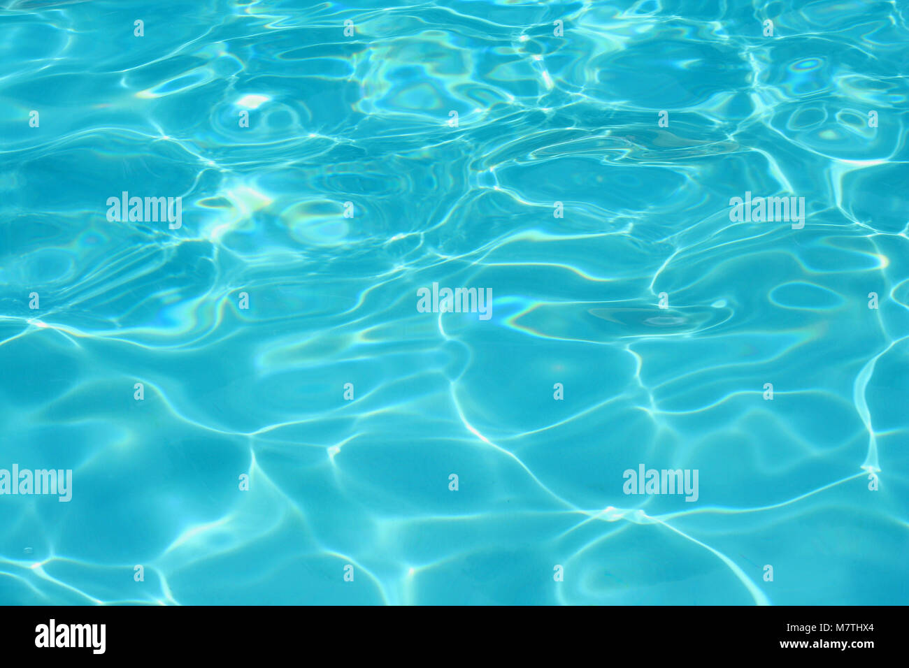 Clear blue swimming pool water background Stock Photo - Alamy