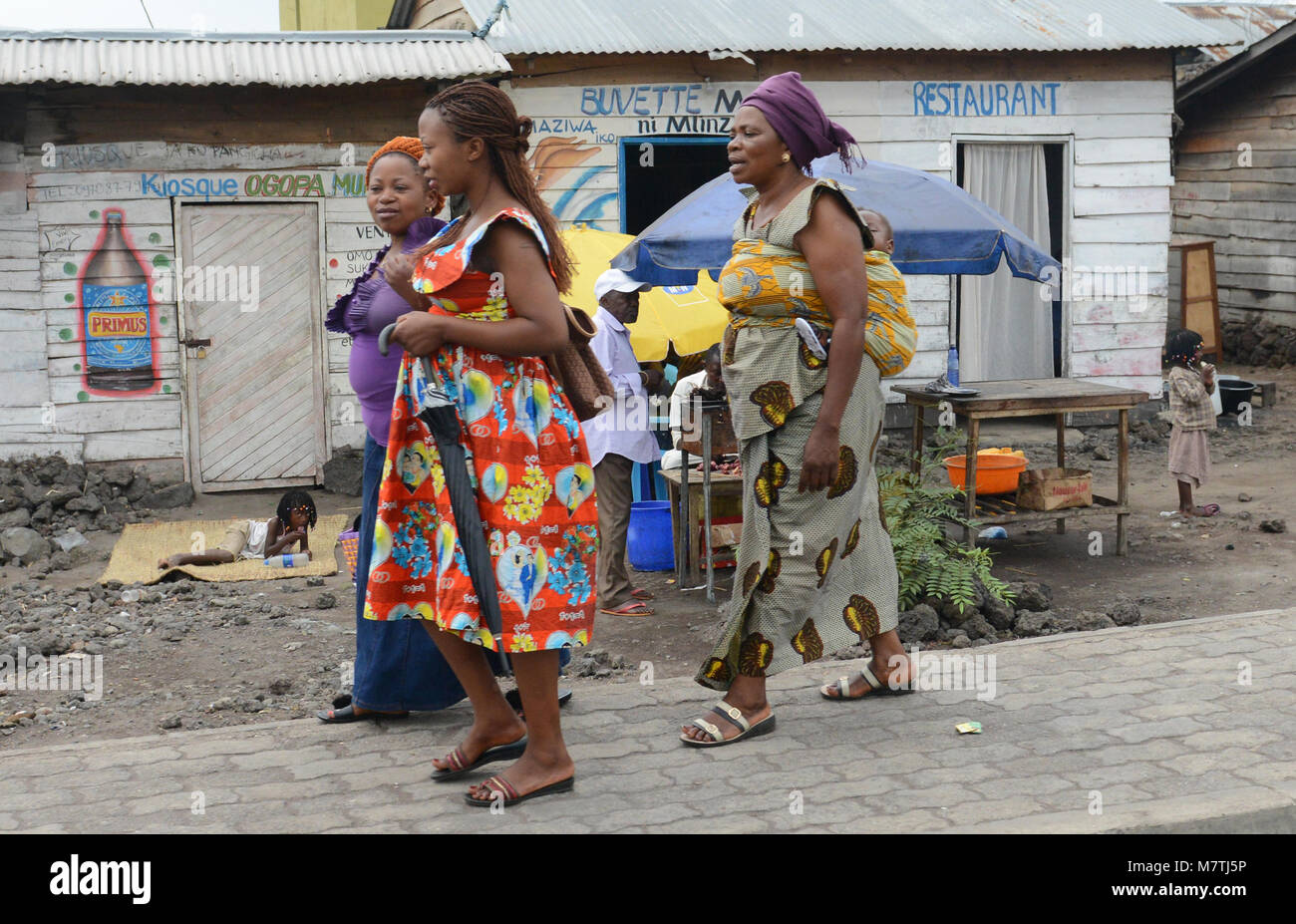 Congolese women walking on Goma's main street Stock Photo - Alamy