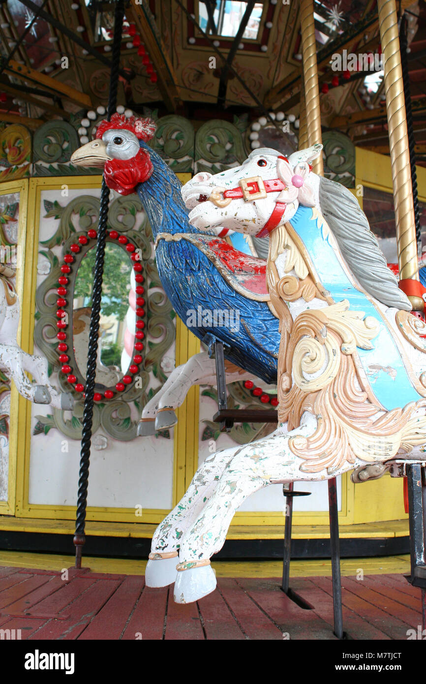 Chicken and a horse on a carousel Stock Photo - Alamy