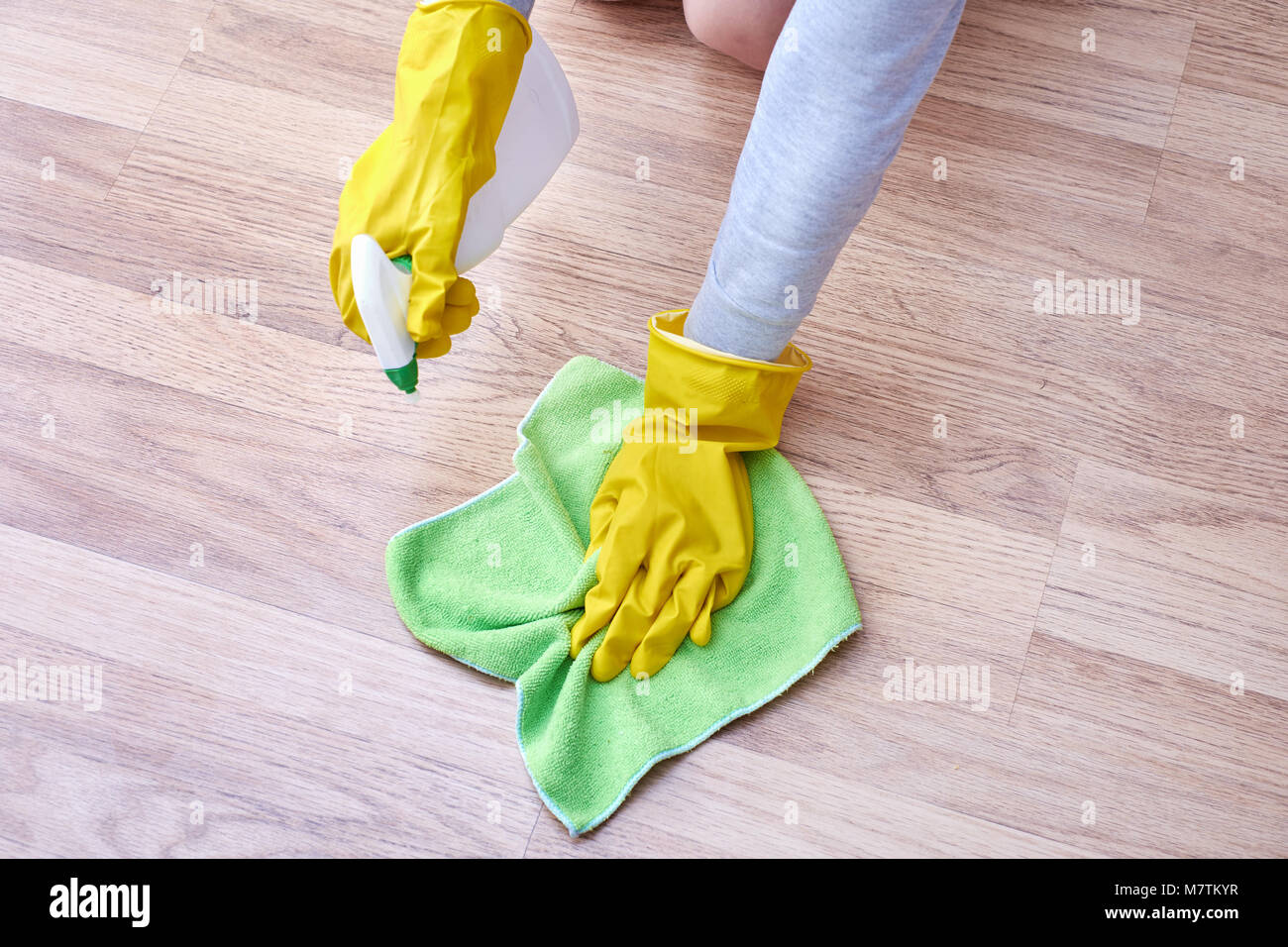 A picture of women hands in yellow gloves cleaning the floor Stock ...