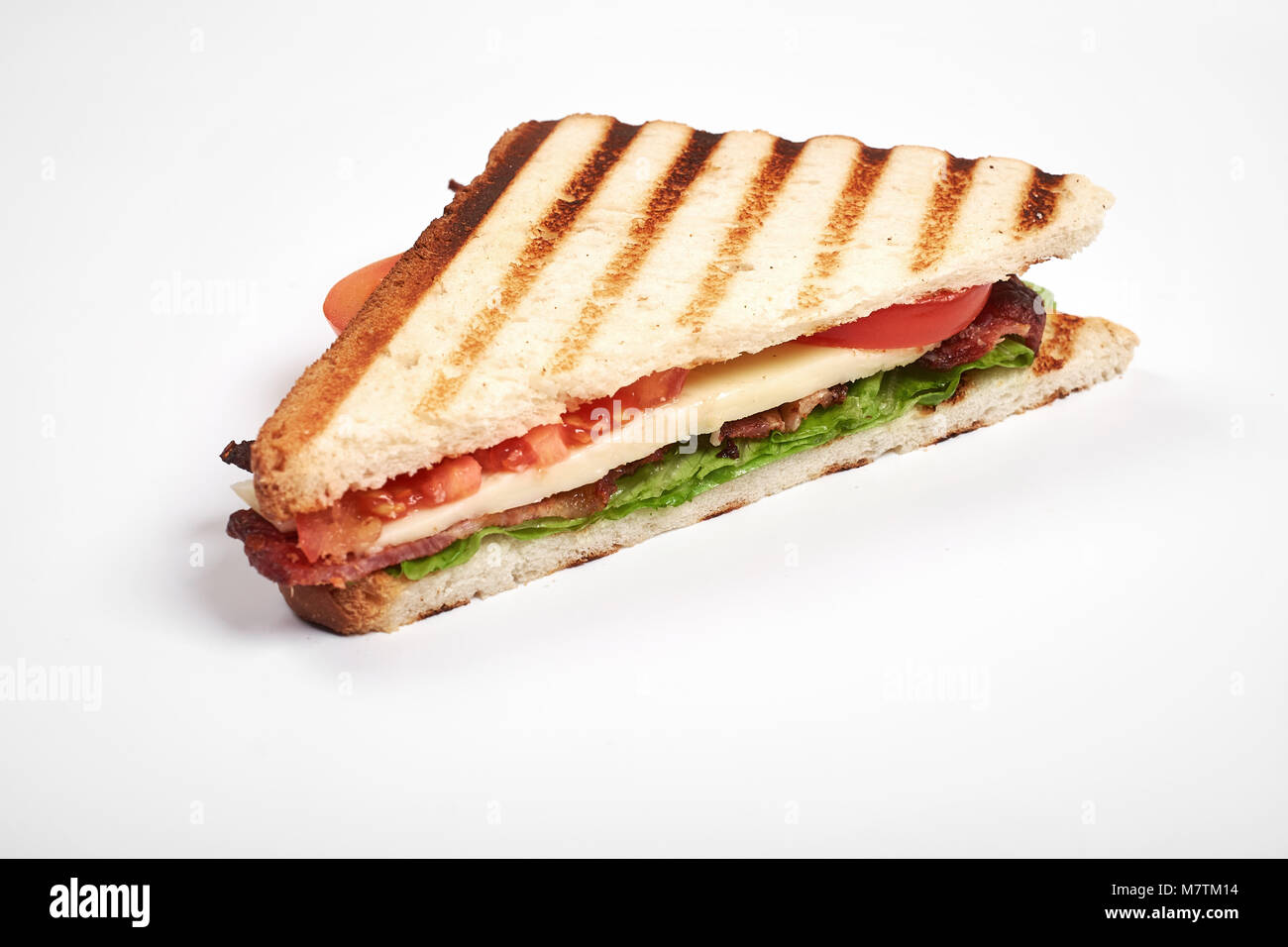 fresh sandwich close up with vegetables and meat isolated on white ...