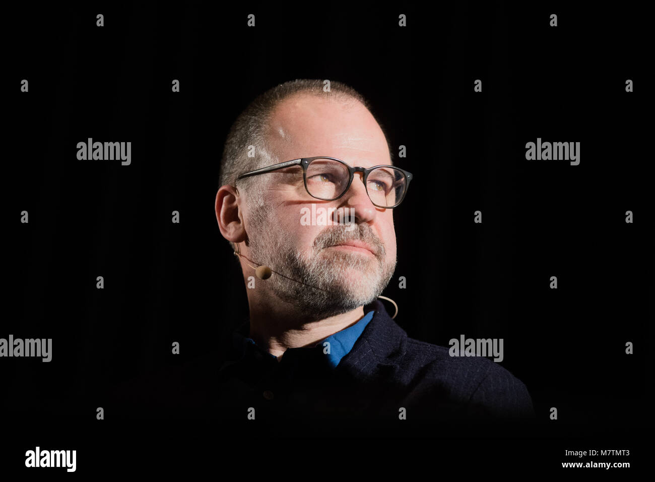 Cologne, Germany. 12th March, 2018. The British author Ian McGuire sits ...