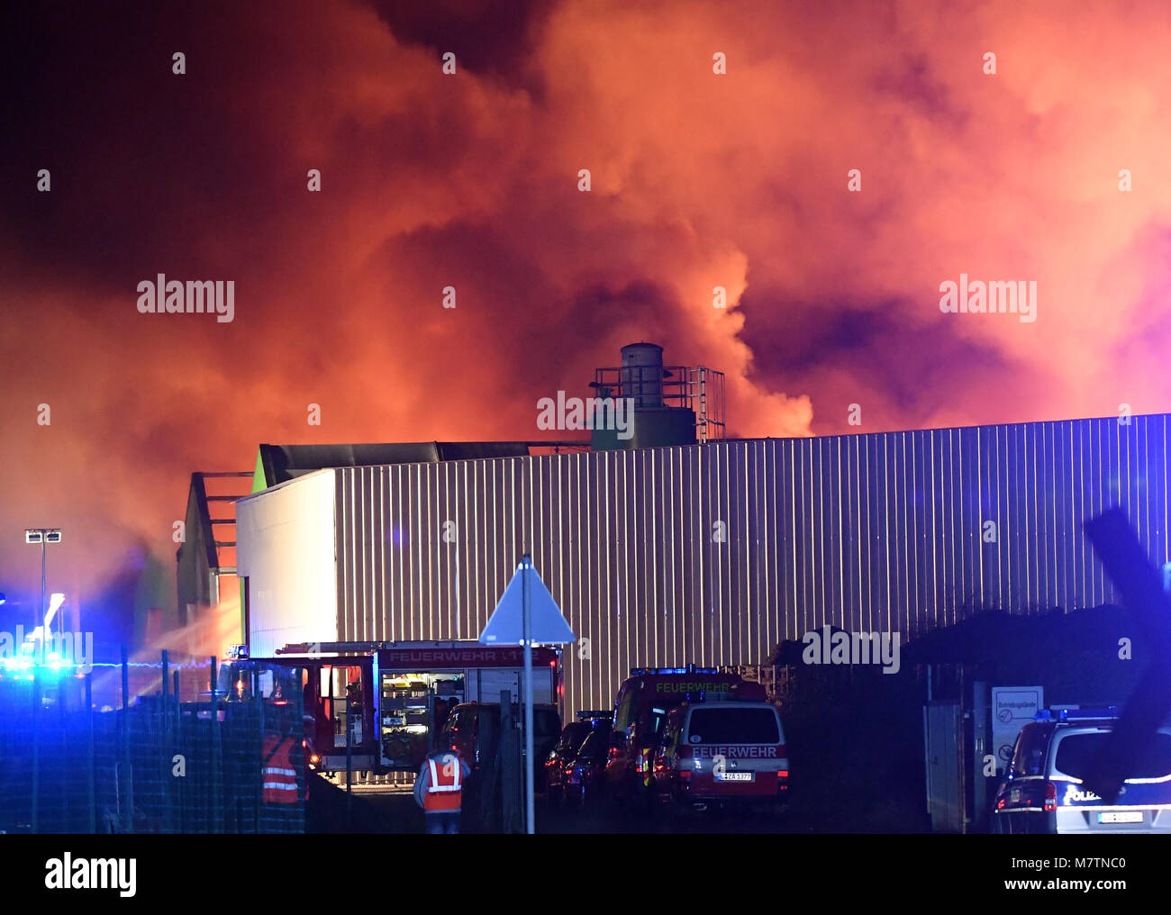 Leipzig, Germany. 12th March, 2018. Heavy smoke clouds arise above ...
