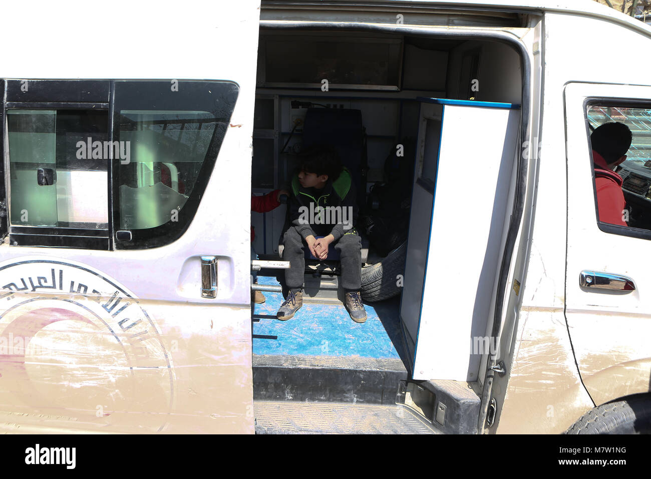 Douma, Eastern Ghouta province, Syria. dpatop - A Syrian child sits ...