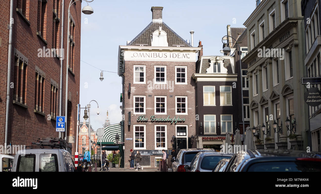 Traditional old dutch buildings in a busy street of Amsterdam Stock ...
