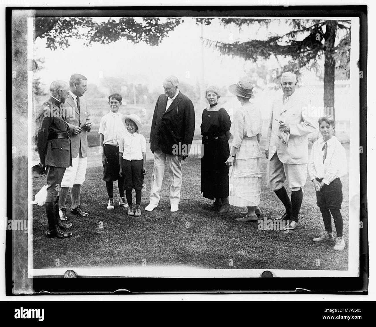 A photograph depicting President Warren G. Harding in a formal setting ...