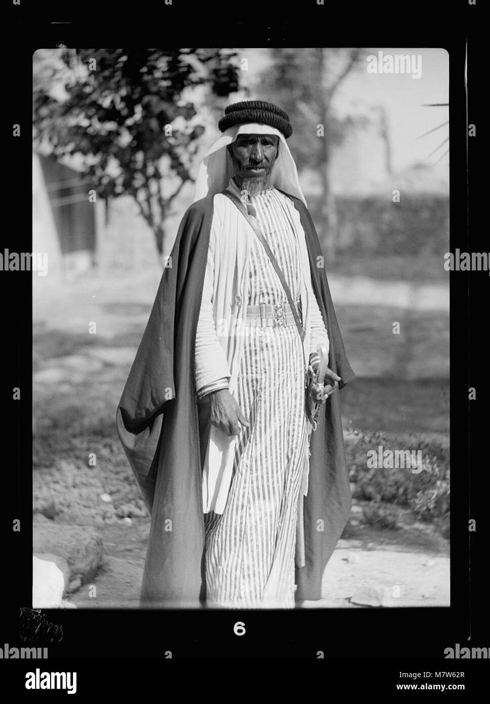 A photograph of Aref el Aref alongside Bedouin sheikhs. This image ...
