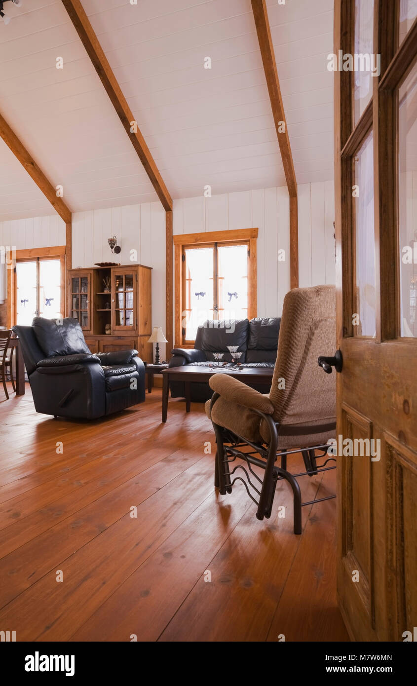 Living room inside the extension of an old Canadiana cottage style ...