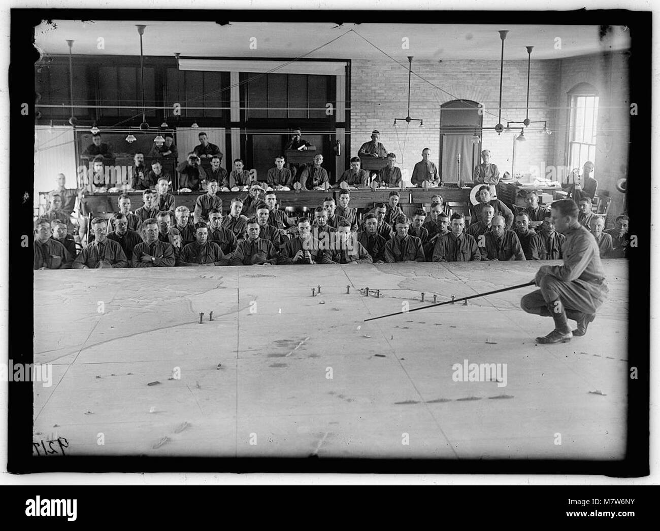 A photograph depicting military training exercises, showing soldiers in action as part of their ...