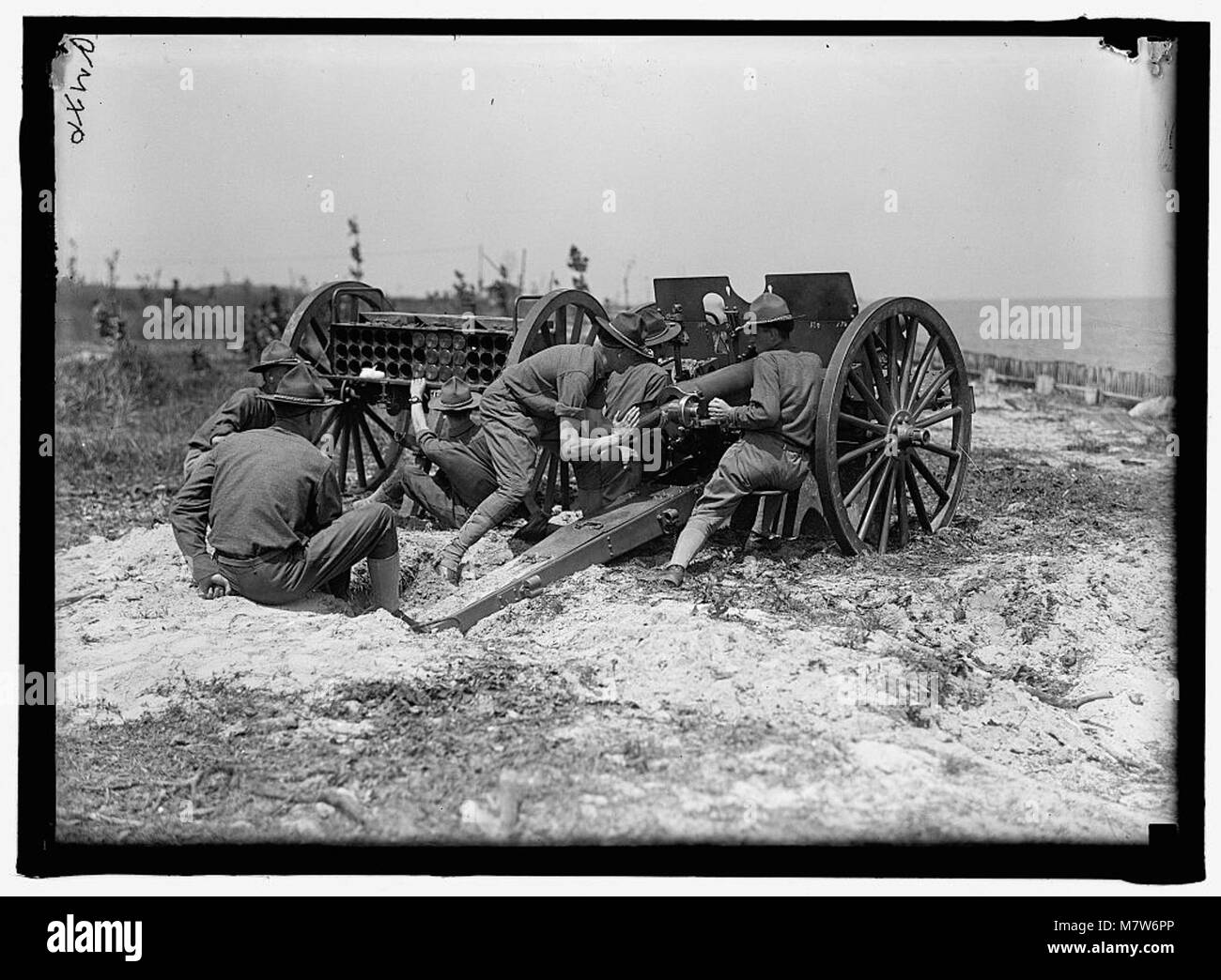 A photograph depicting military training, likely from the early 20th century. The image captures ...