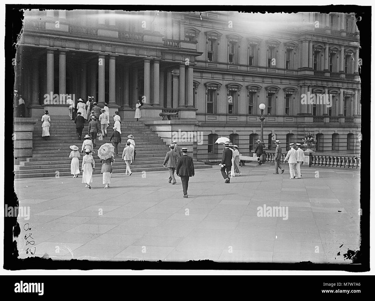 A photograph showing people entering the U.S. State Department building ...
