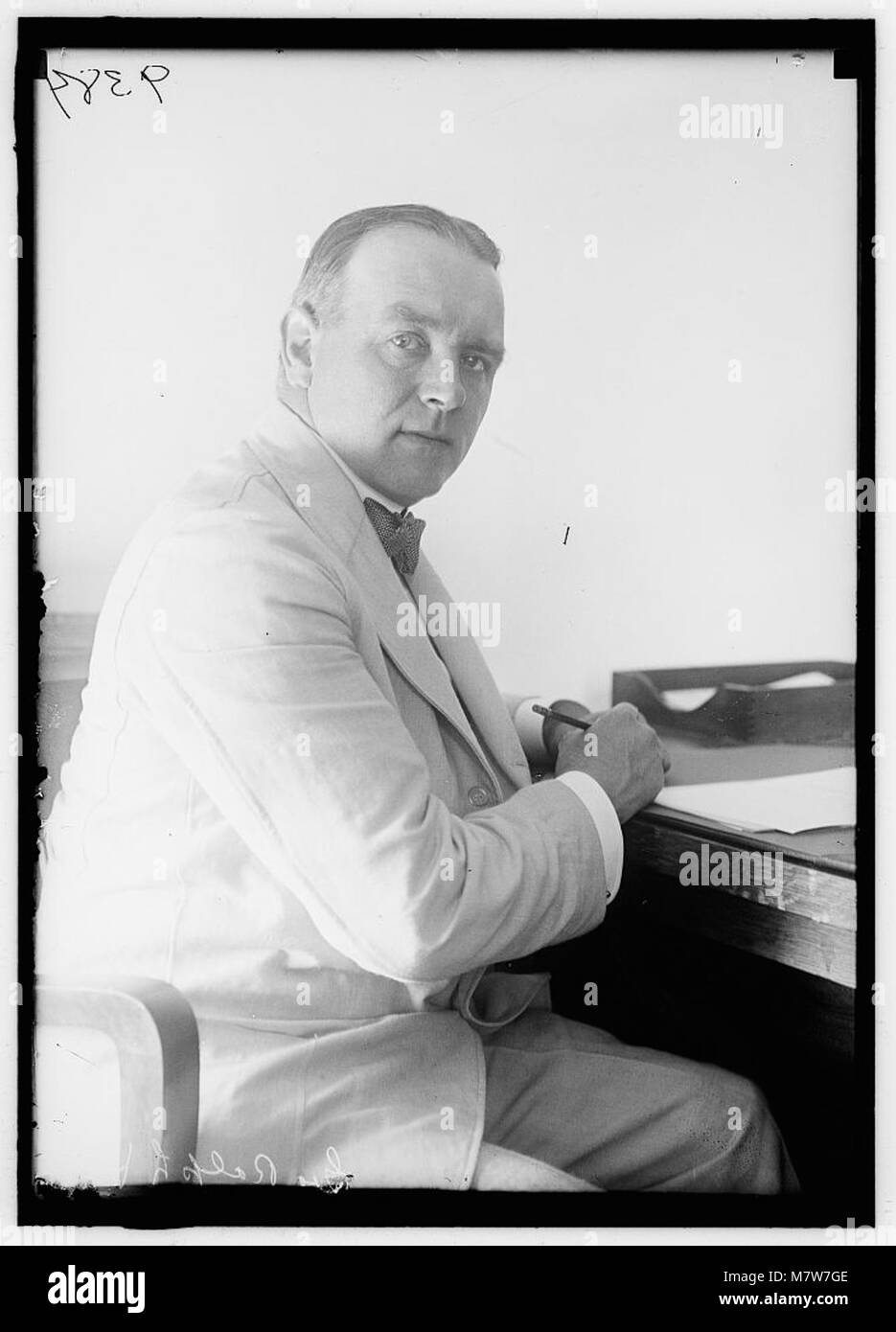 Formal portrait of George Rolph, captured in a classic early 20th ...