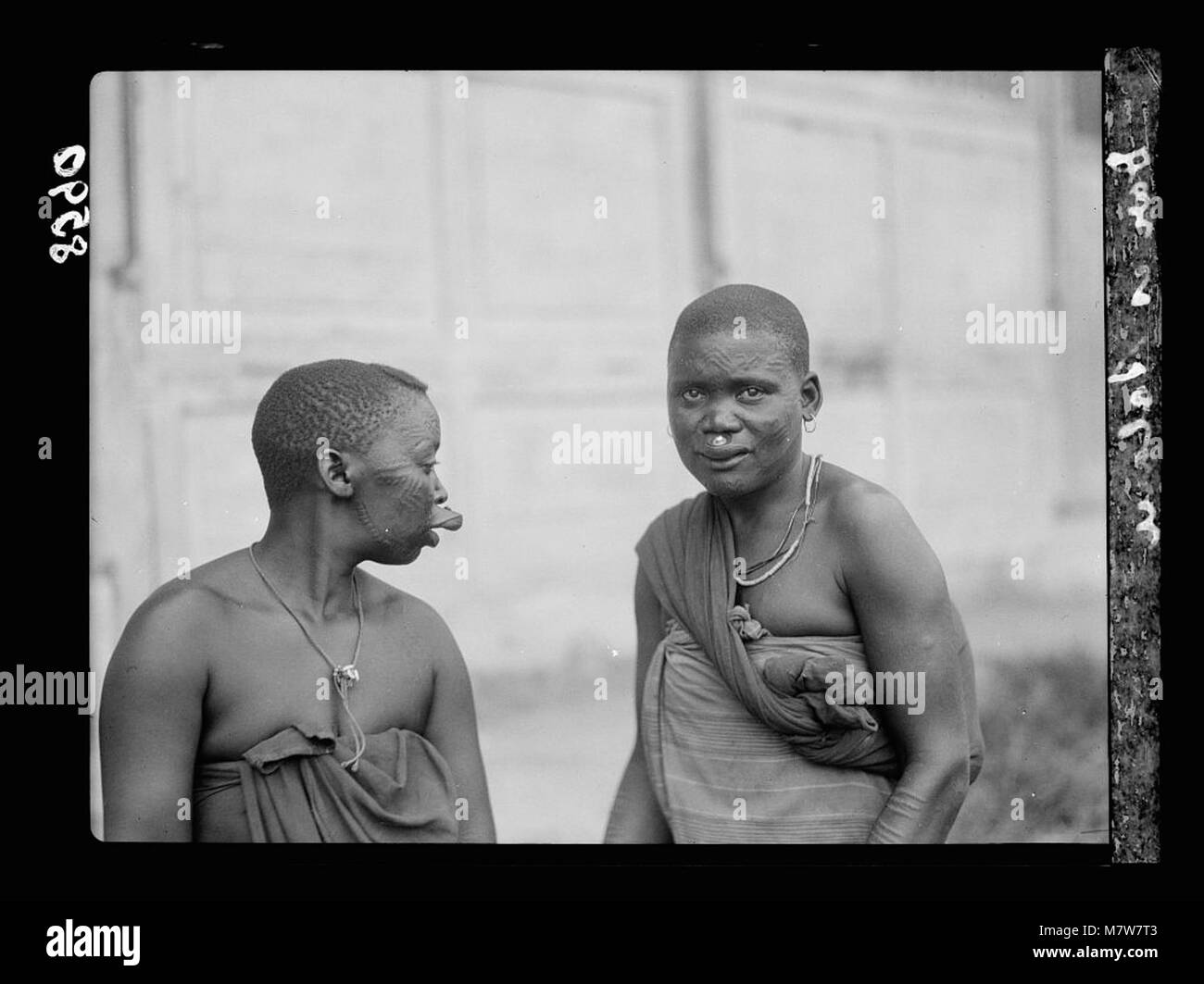 This photograph depicts native women from Dar-es-Salem, Tanganyika ...