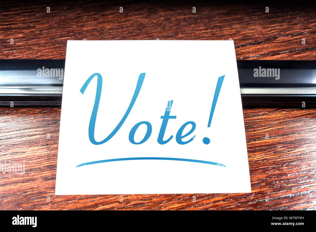 Vote Sticky Note On Paper Lying On Wooden Cupboard Stock Photo - Alamy