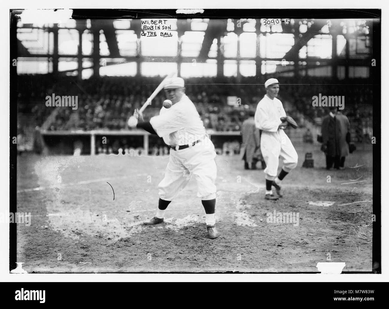 An action shot of Wilbert Robinson, manager of the Brooklyn National ...