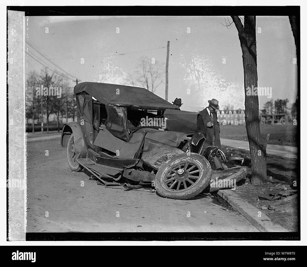 An image capturing the aftermath of an auto wreck, documenting the ...