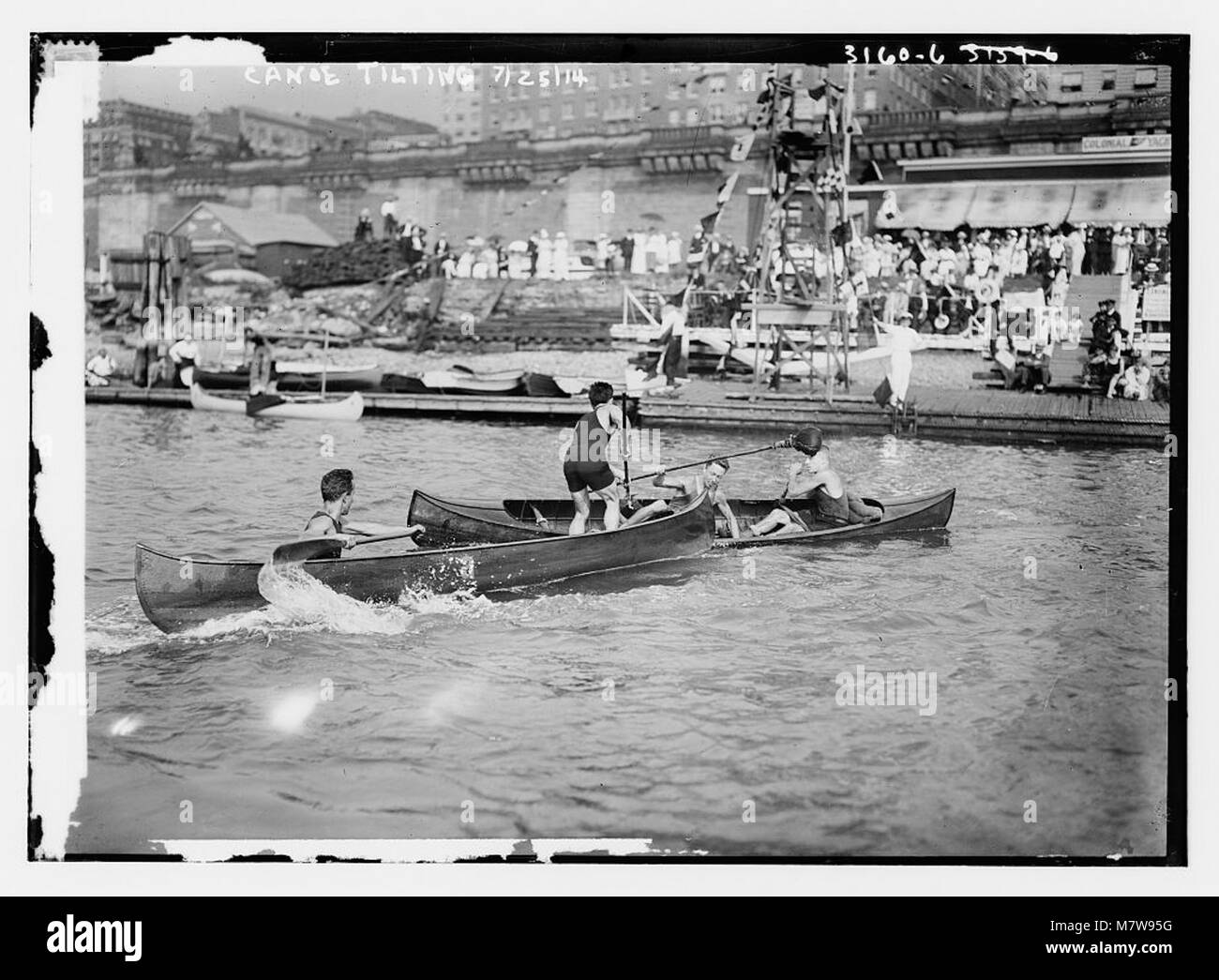 A photograph showing a canoe tilting, possibly as part of a water sport ...