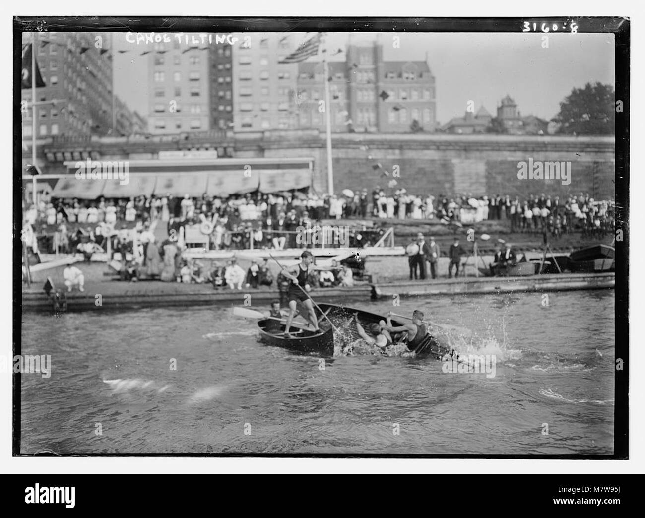 This image captures a canoe tilting, possibly during a maneuver or ...