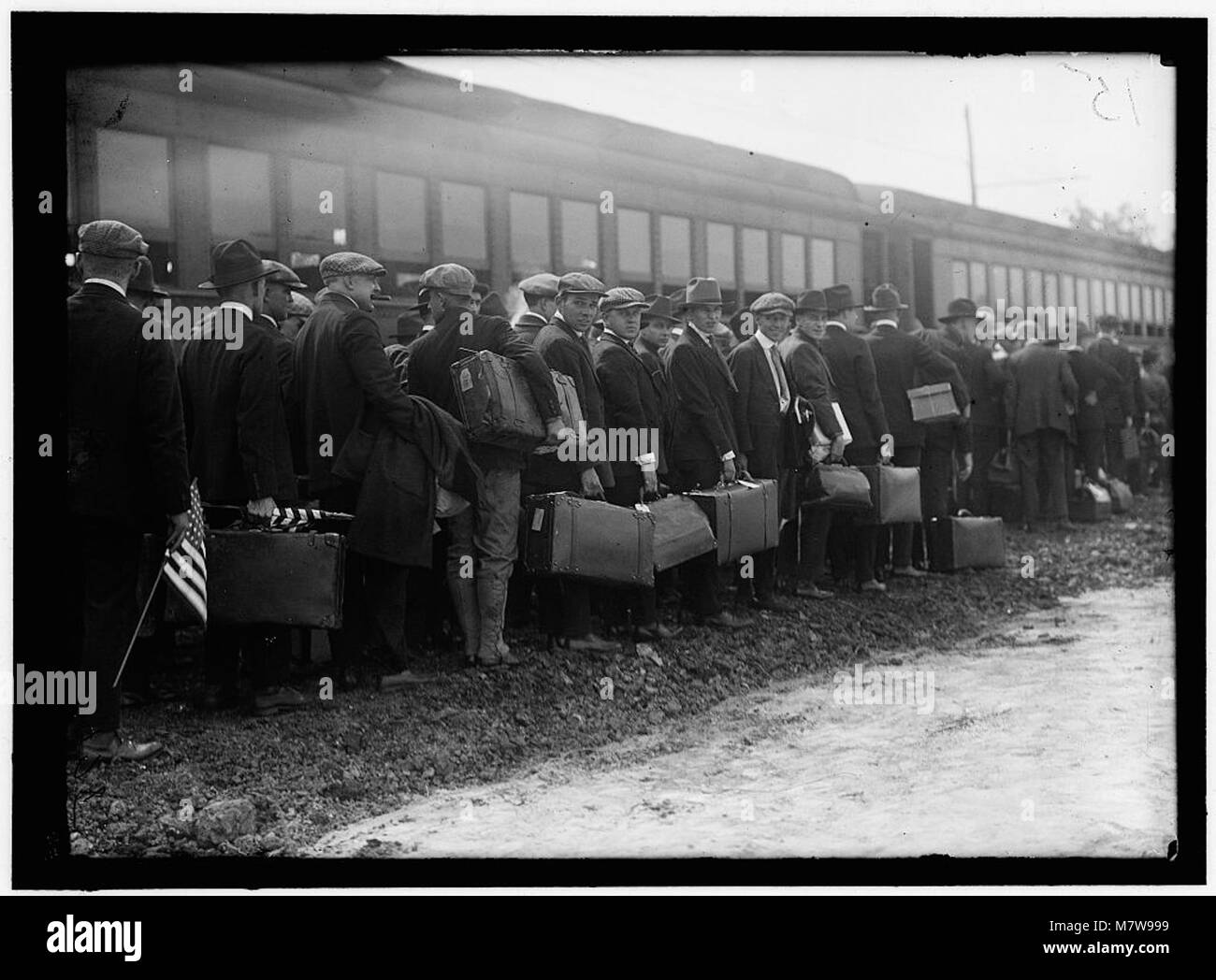 A historical photograph showing the arrival of drafted men at Camp ...
