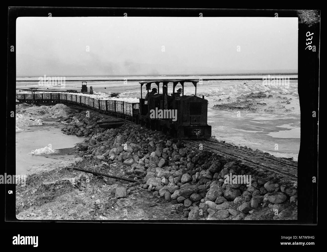 The image shows a train carrying carnallite, a mineral harvested from ...