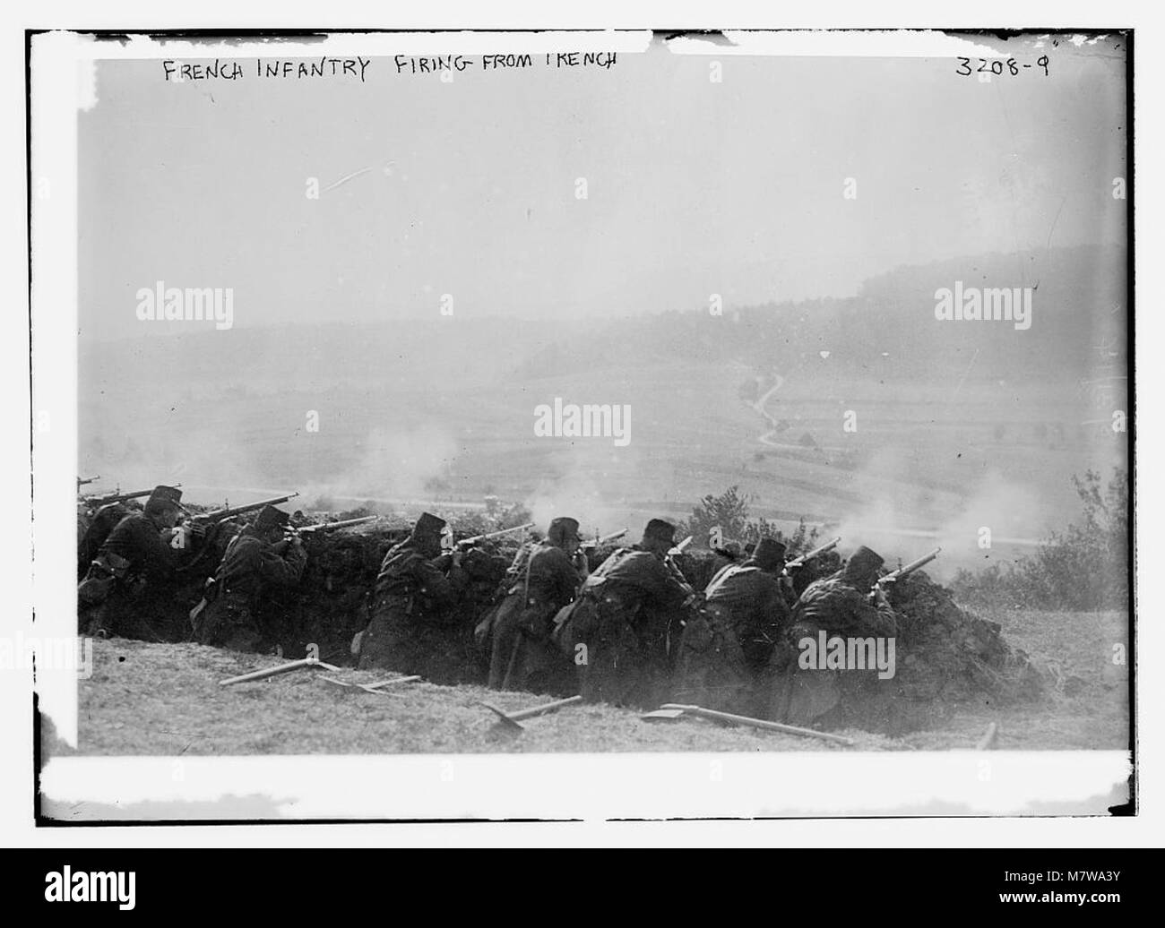 Photograph of French infantry soldiers firing from a trench, capturing ...