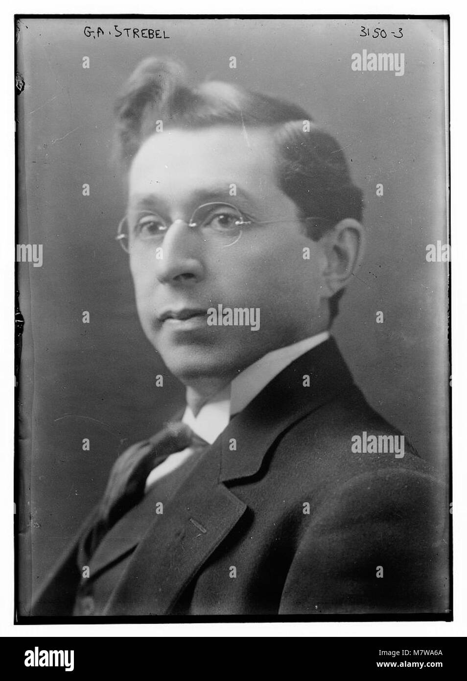 This image features G.A. Strebel, captured in a formal portrait, a ...