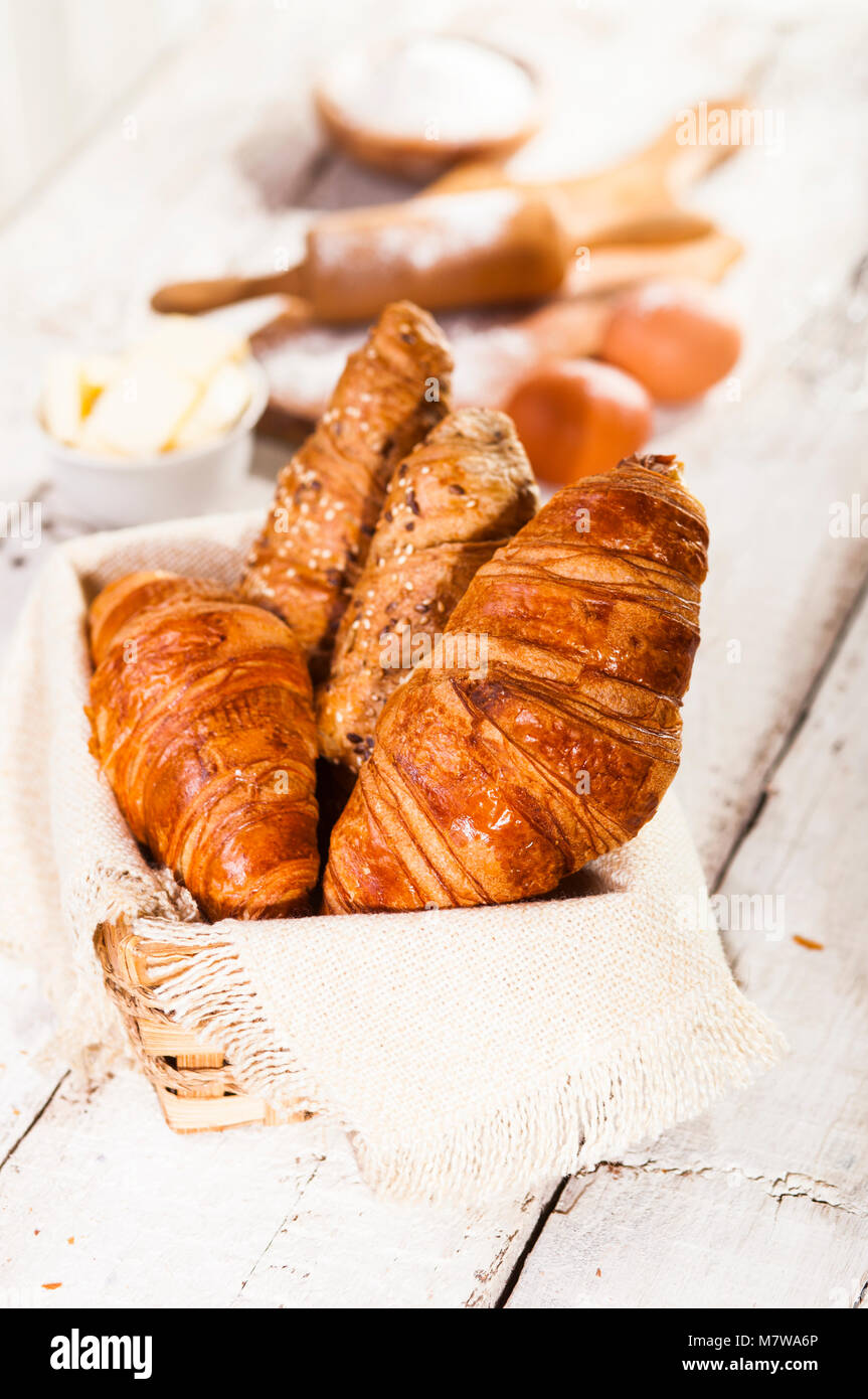 Baked croissants and ingredients for the preparation of bakery products ...