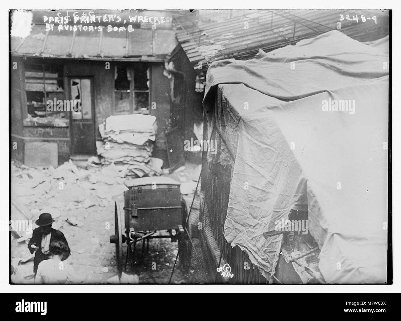 A dramatic photograph of a Paris printing establishment destroyed by an ...