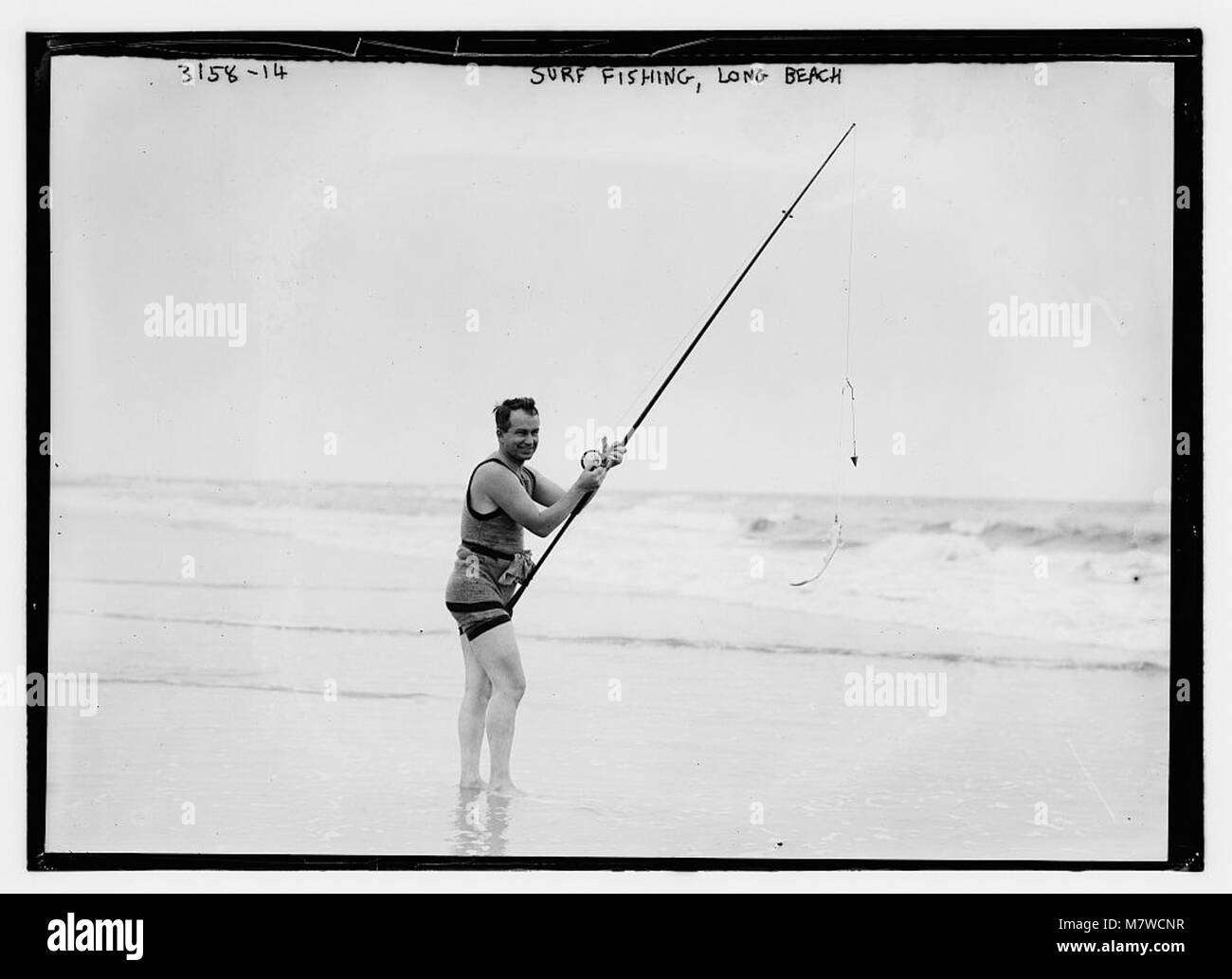 A scene of surf fishing at Long Beach, showing fishermen engaging in ...