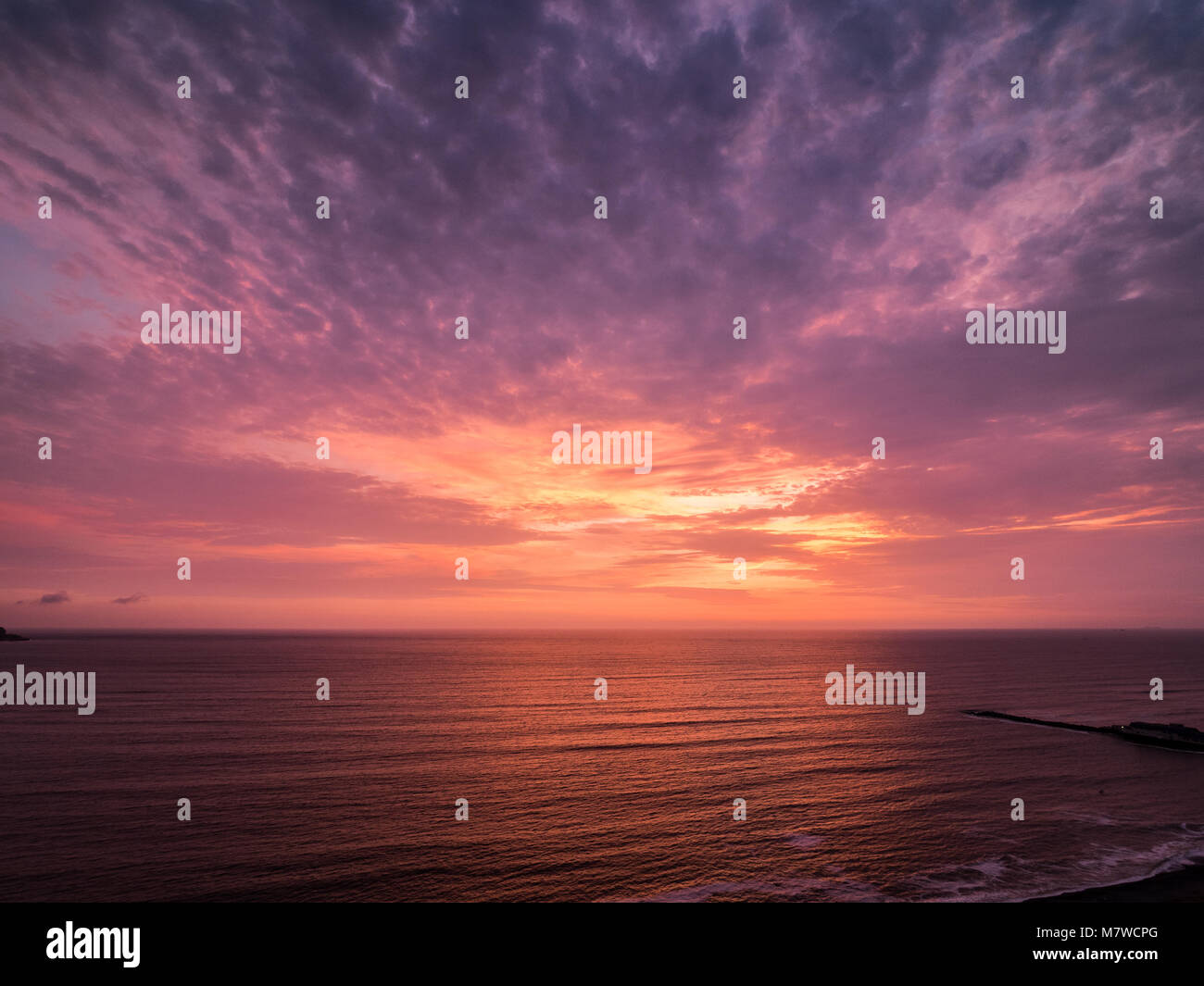 The pink color of the Lima sunset, Peru Stock Photo - Alamy